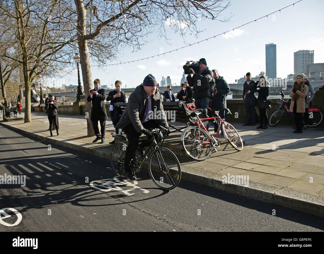 Mayor of London Boris Johnson arrives by bike to view progress on East ...