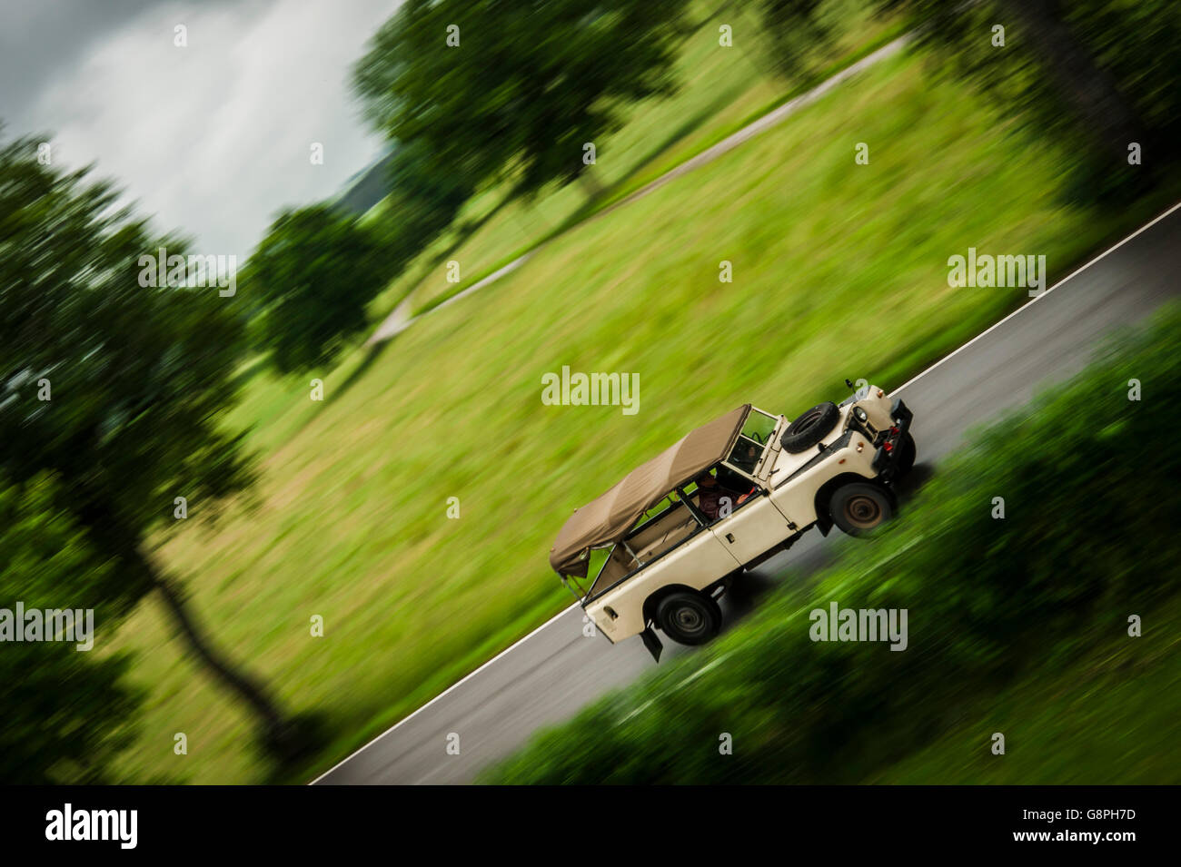Old fashioned car driving open road hi-res stock photography and images ...