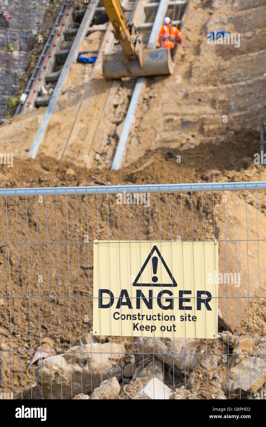 Abseilers clear fallen debris at East Cliff in June from the landslide ...