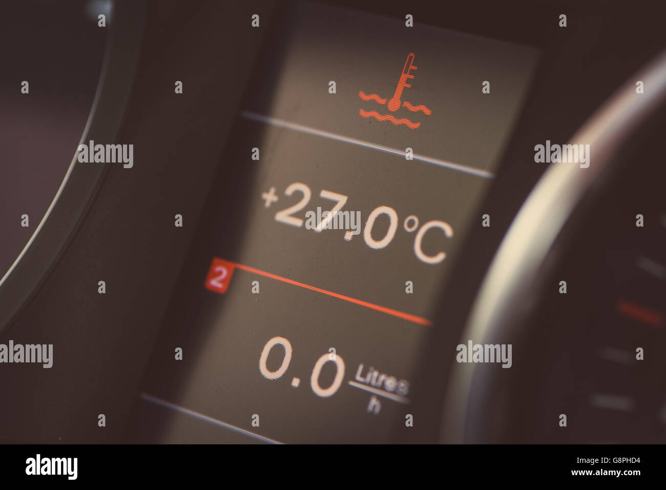 Close up shot of a car's electronic dashboard, with coolant warning on ...