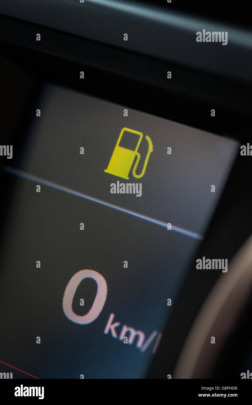 Close up shot of a car's dashboard with the fuel icon lit Stock Photo ...