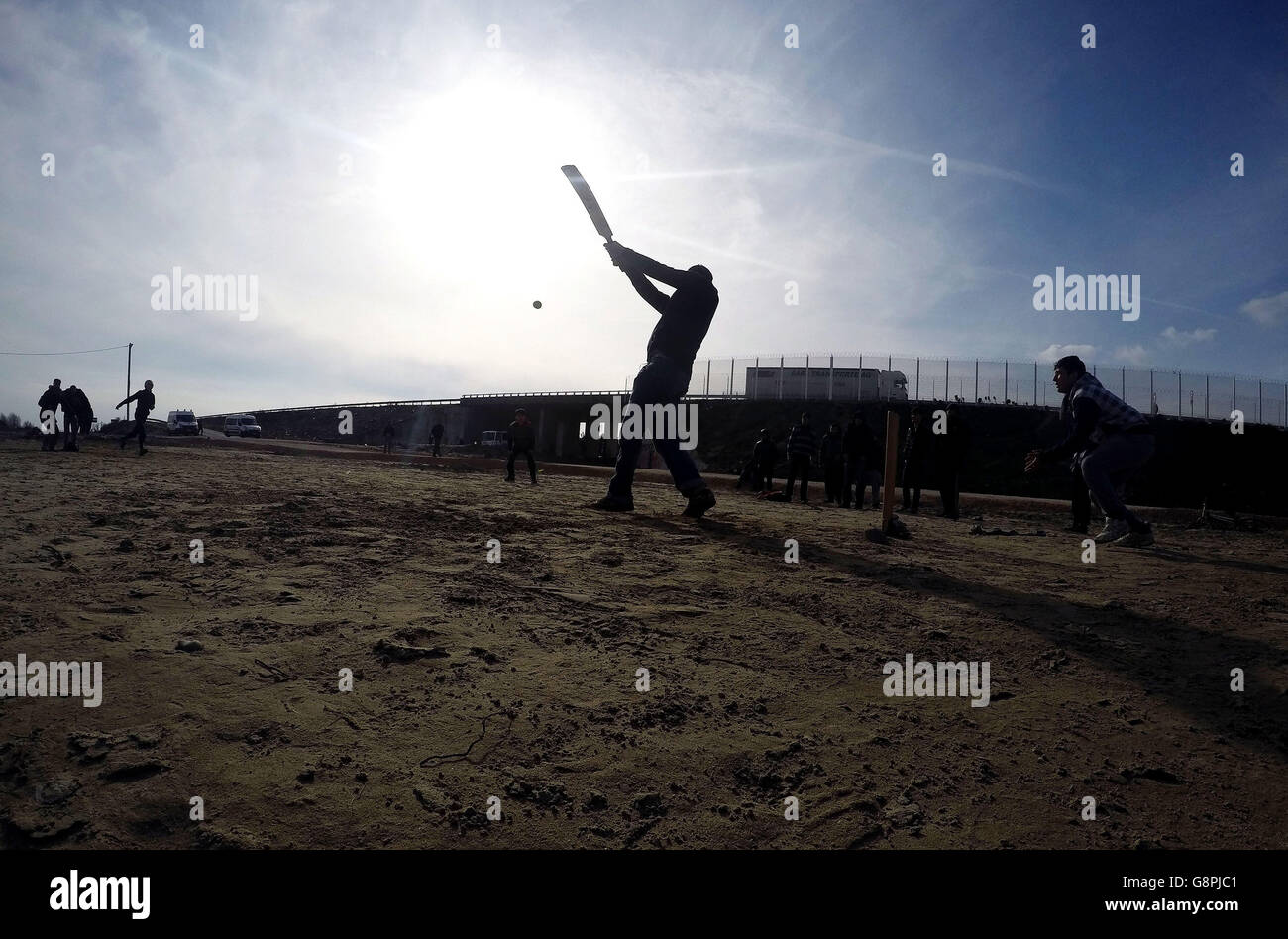 Refugees play cricket in the jungle migrant camp in Calais, France ...