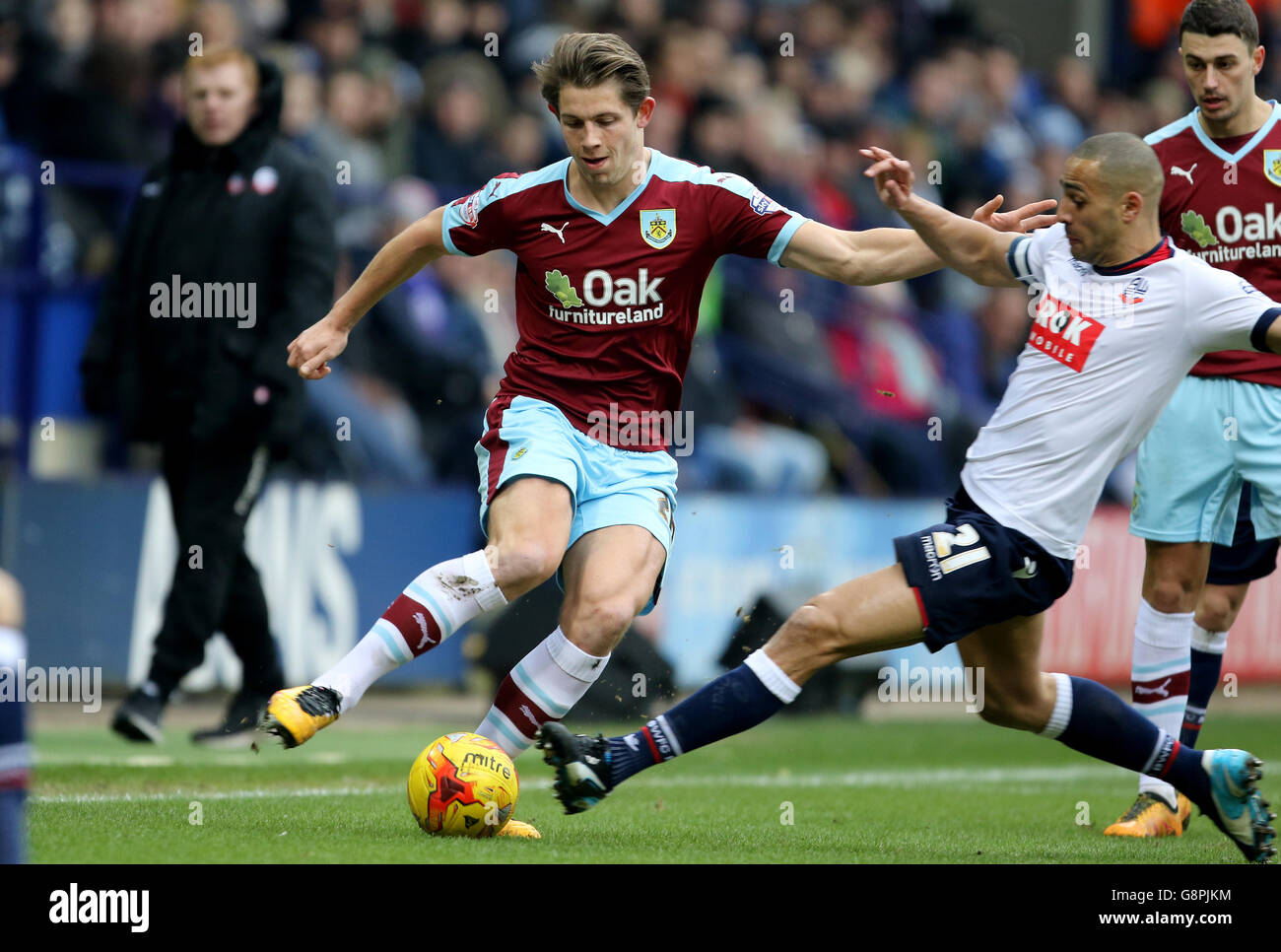 Bolton Wanderers' Darren Pratley fouls Burnley's James Tarkowski (left ...