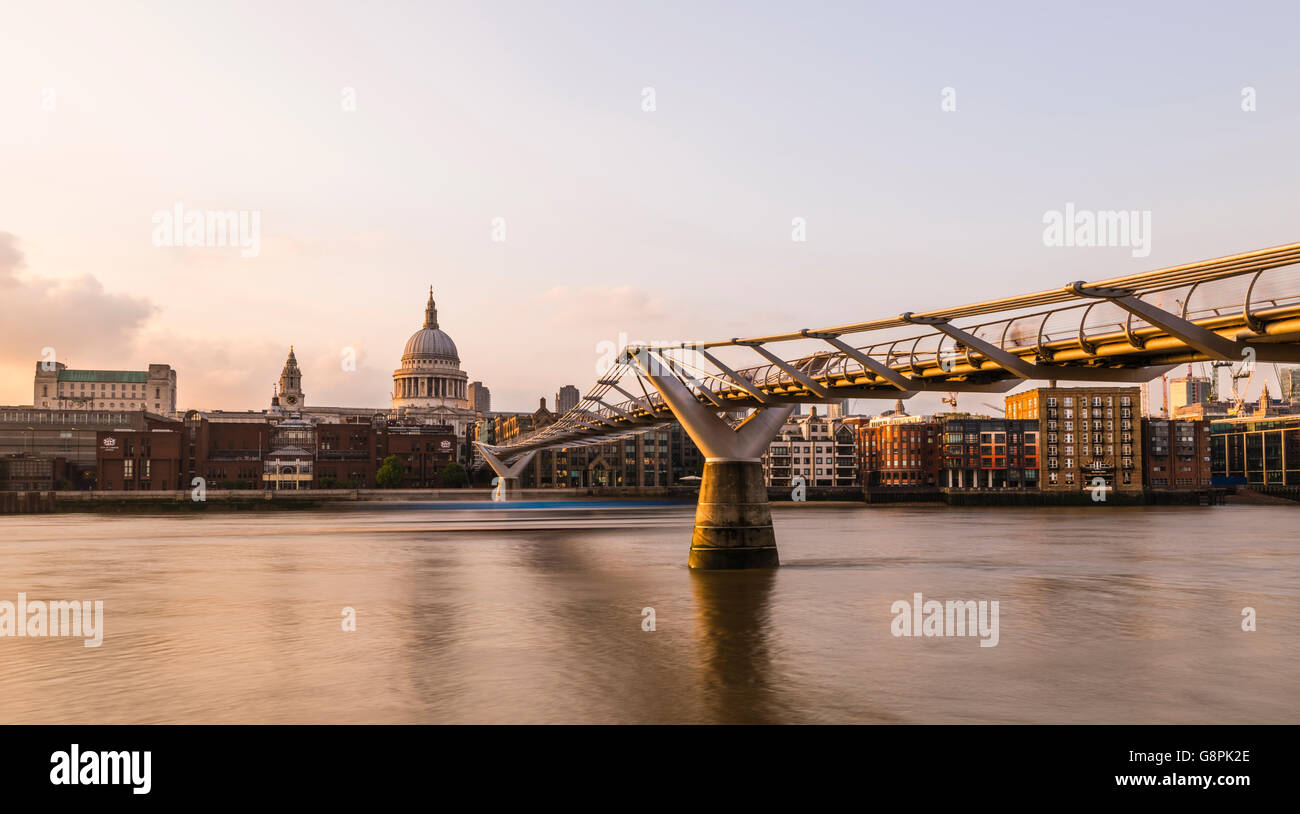 Glorious orange light of dusk on the Millennium Bridge at Bankside ...