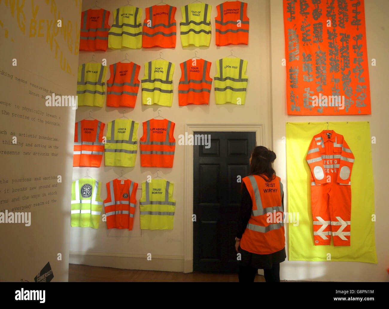 A woman looks at an artwork by Petro called Utopia Security Co.High ...