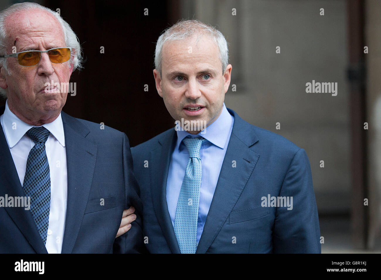 Ocado chief executive Tim Steiner (right) leaves The Royal Courts of ...