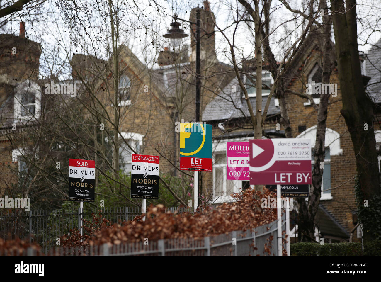 A row of Sold and Let By estate agent signs outside houses in north ...