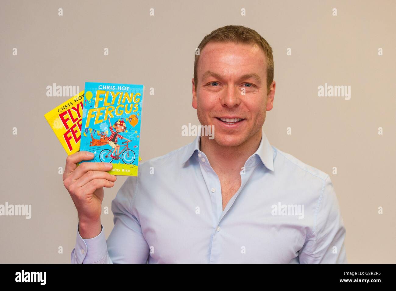 Sir Chris Hoy with copies of his children's book 'Flying Fergus' at a ...