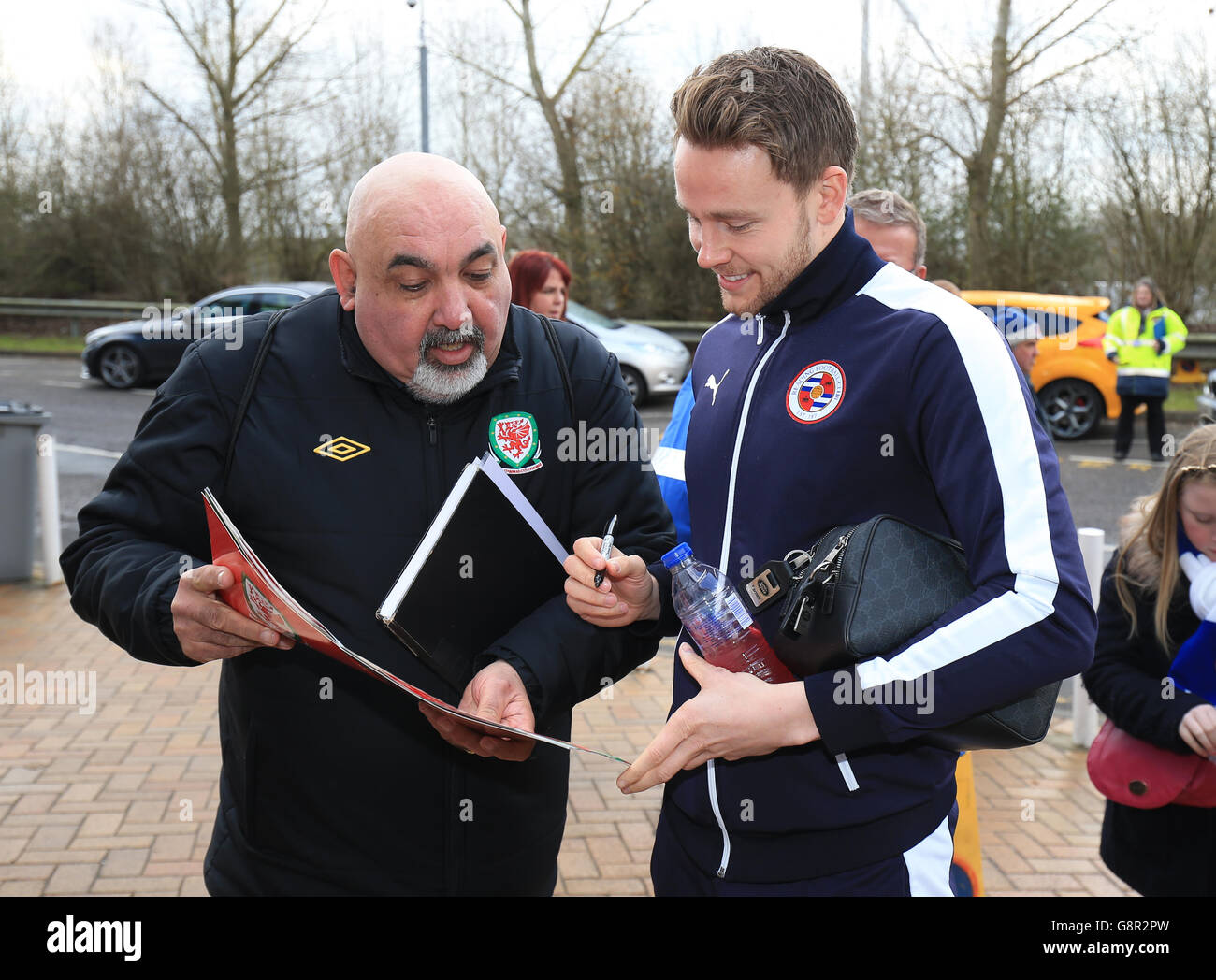 Reading's Chris Gunter (right) signs autographs before the game against ...