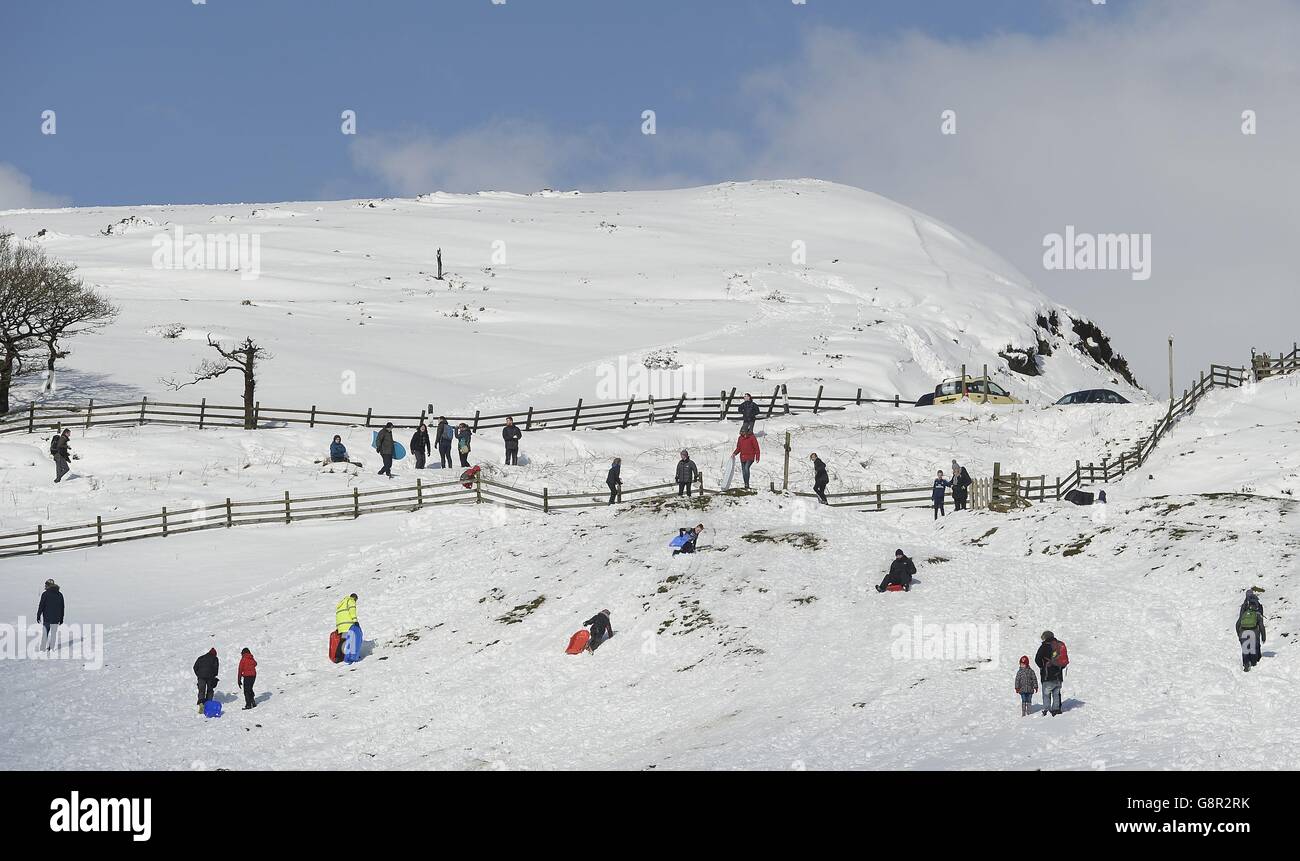 People in the snow near Mam Tor in the Peak District, as March ...