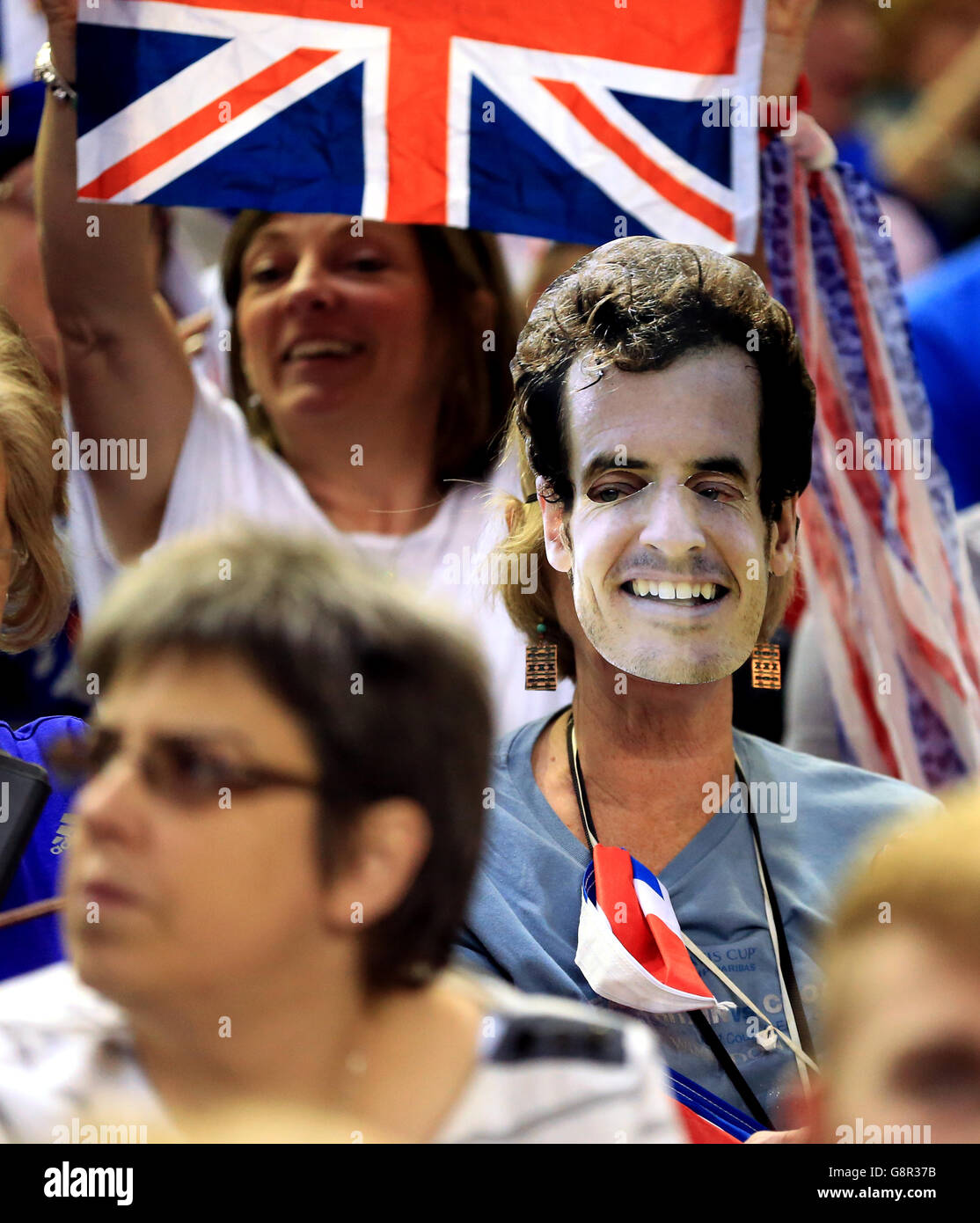 A Great Britain fan wearing an Andy Murray face mask during day two of ...