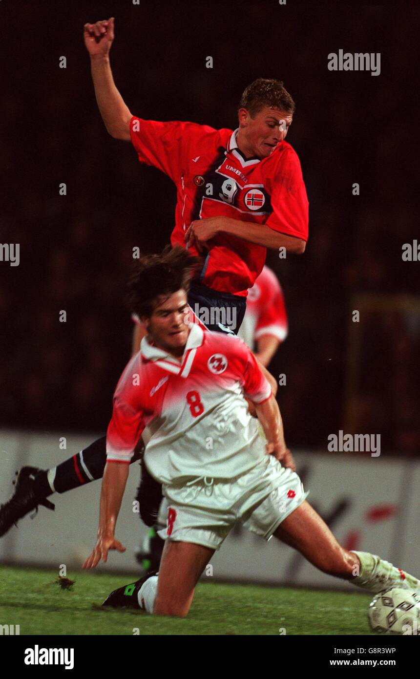 Tore Andre Flo of Norway (back) is tackled by Raphael Wicky of ...
