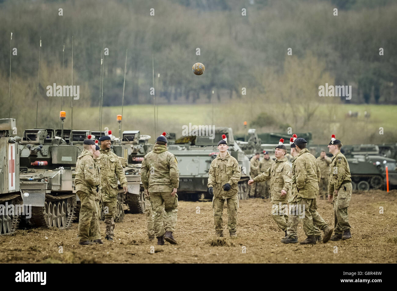 Soldiers from the 1st Battalion First Fusiliers kick a football around ...