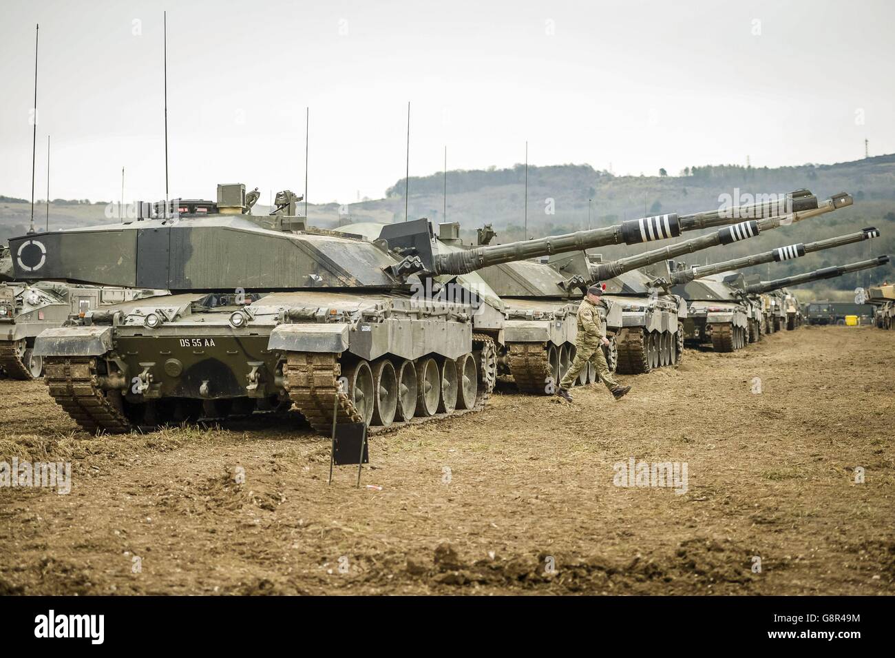 A soldier walks past a row of Challenger II main Battle Tanks as the ...