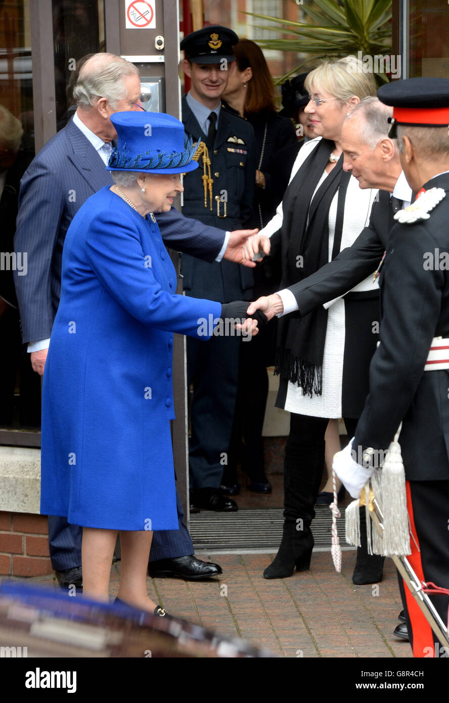 Queen Elizabeth II and the Prince of Wales shake hands with the Lord ...