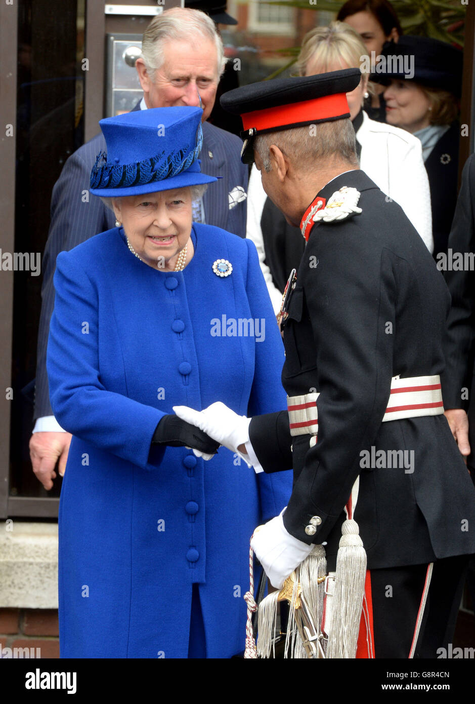 Queen Elizabeth II and the Prince of Wales shake hands with the Lord ...