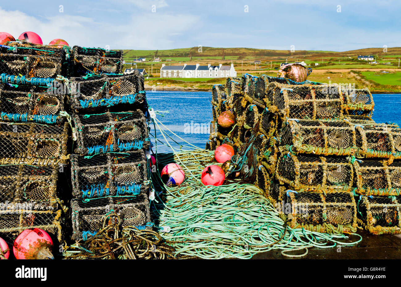 Lobster, cray and crab pots stacked up on the pier in Portmagee, County ...