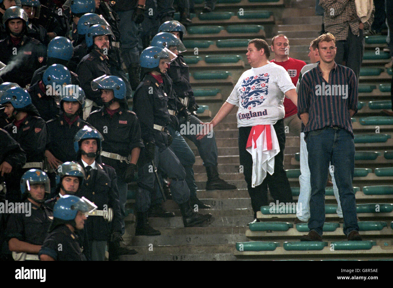 An England fan (right) appeals to the Italian police after they led a ...