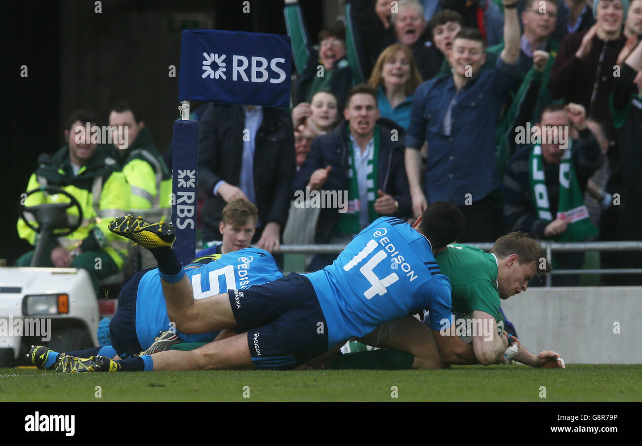 Ireland's Andrew Trimble goes over to score his side's first try during ...
