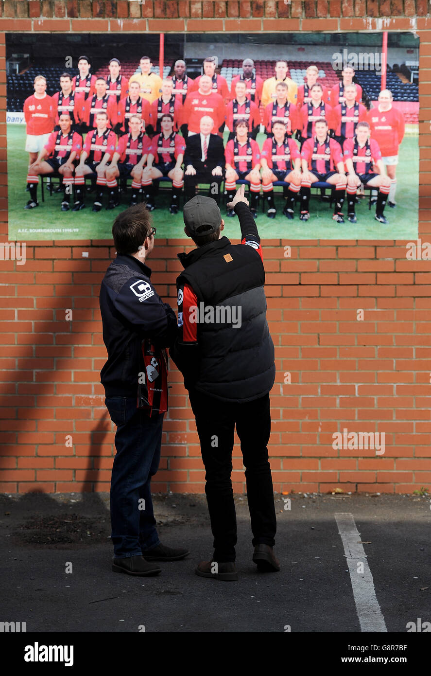 AFC Bournemouth supporters admire an old team photo outside the ground ...
