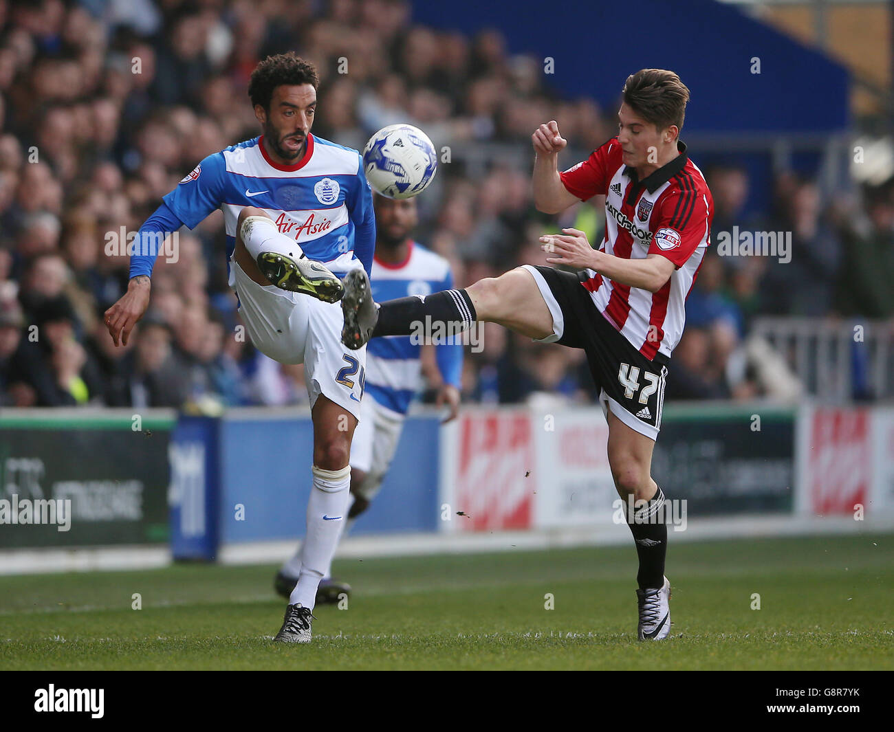 Queens Park Rangers' James Perch and Brentford's Sergi Canos (right ...