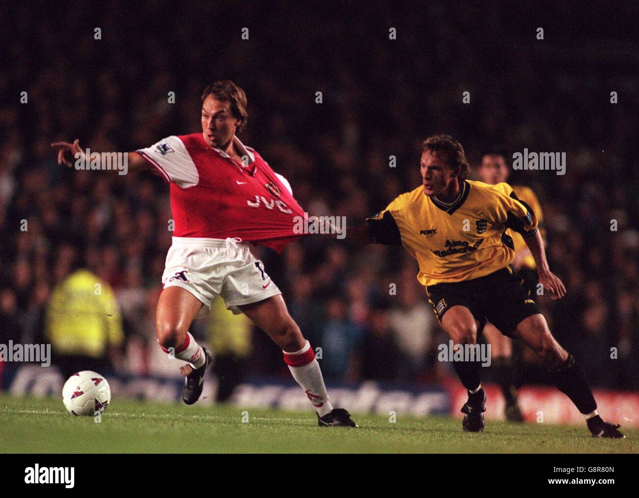 Arsenal's David Platt (left) is held back by Birmingham City's goal ...