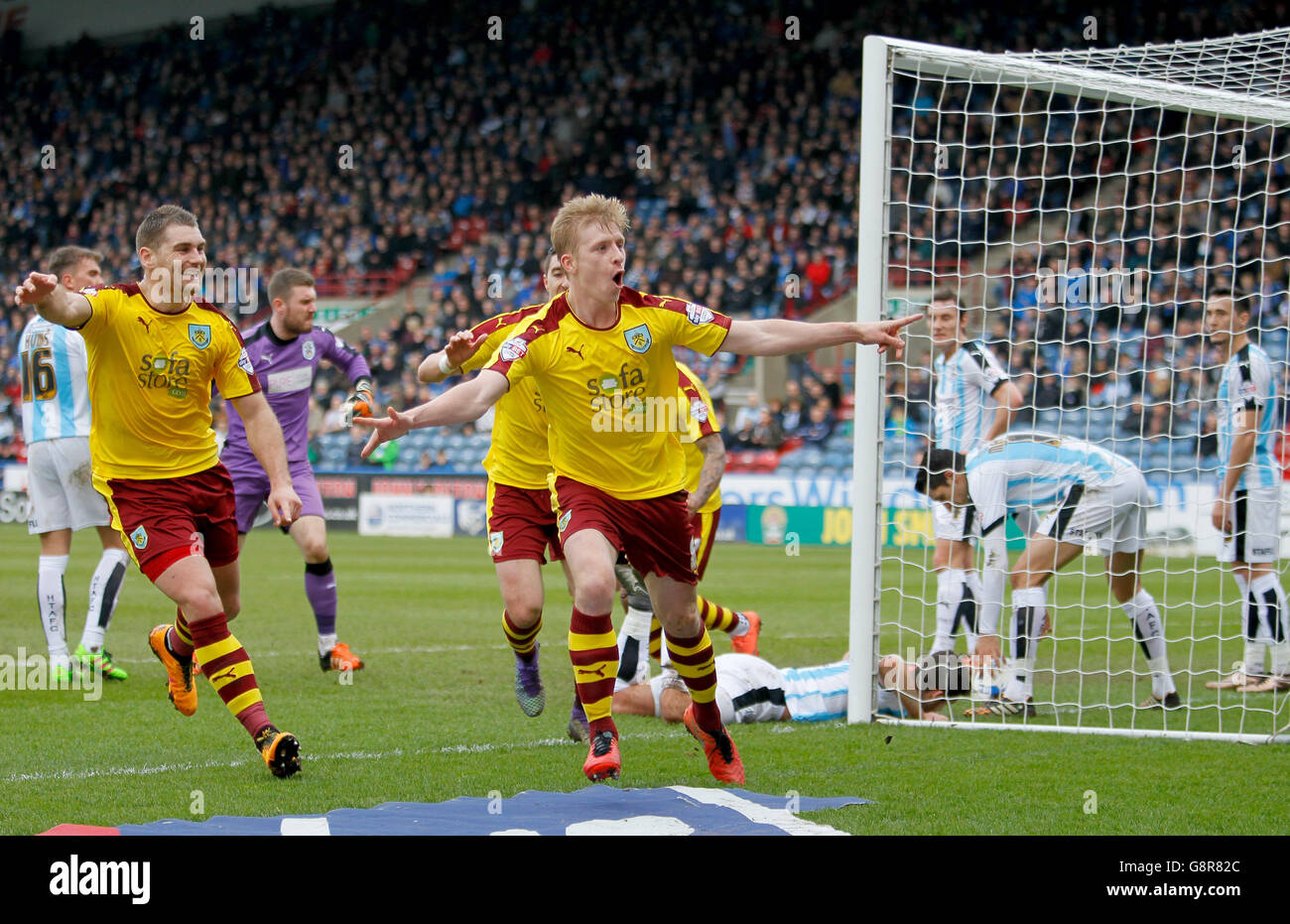 Burnley's Ben Mee (right) celebrates scoring his side's third goal of ...
