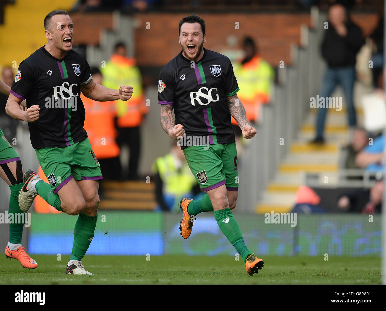 Bristol City's Lee Tomlin (right) celebrates scoring the winning goal ...