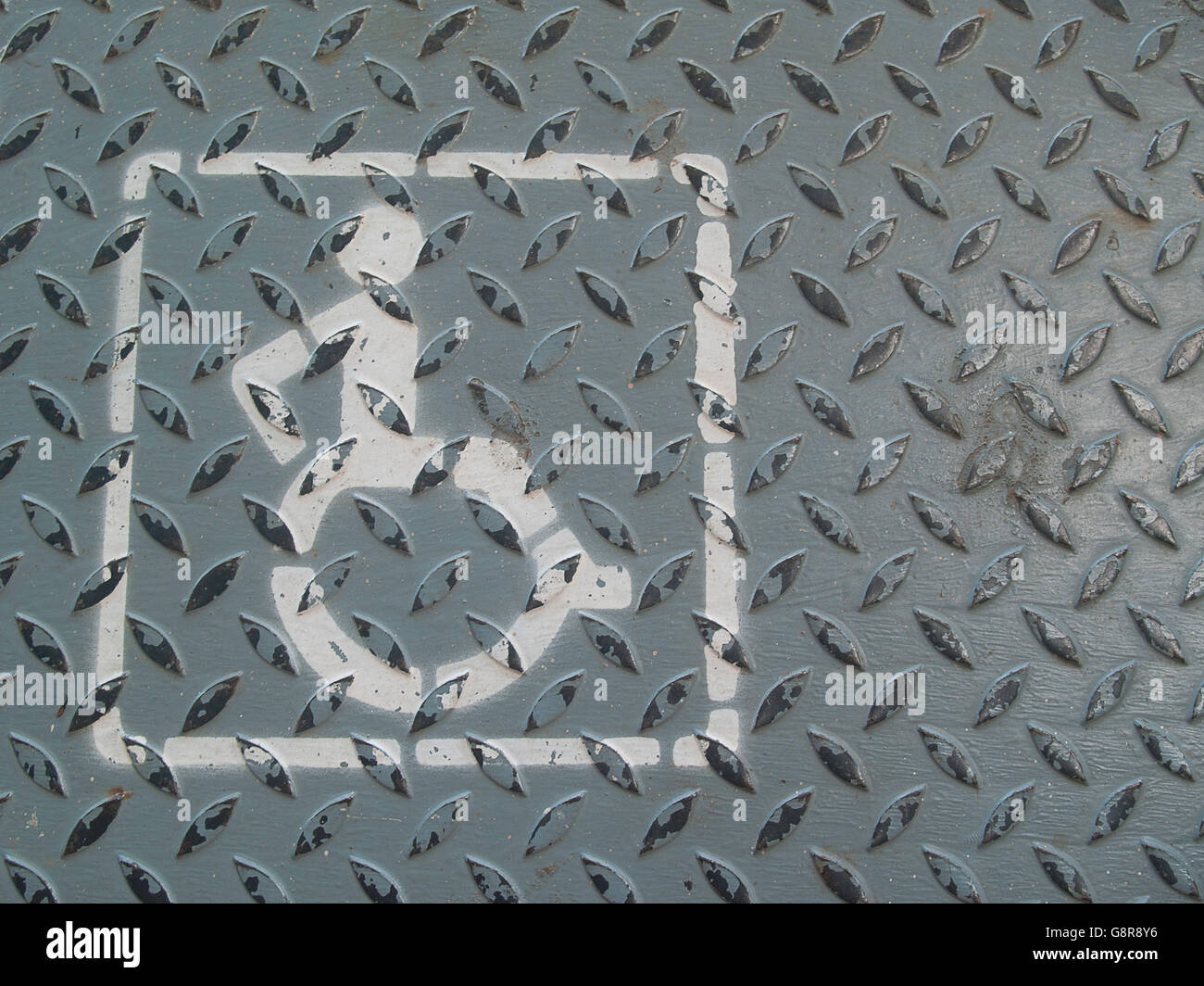 Wheelchair handicap sign lane on grey metal background Stock Photo - Alamy