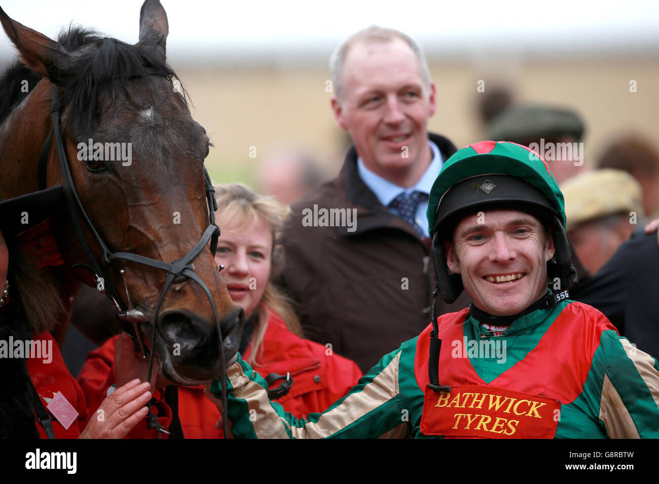 Jockey Tom Scudamore celebrates with Un Temps Pour Tout in the winners ...