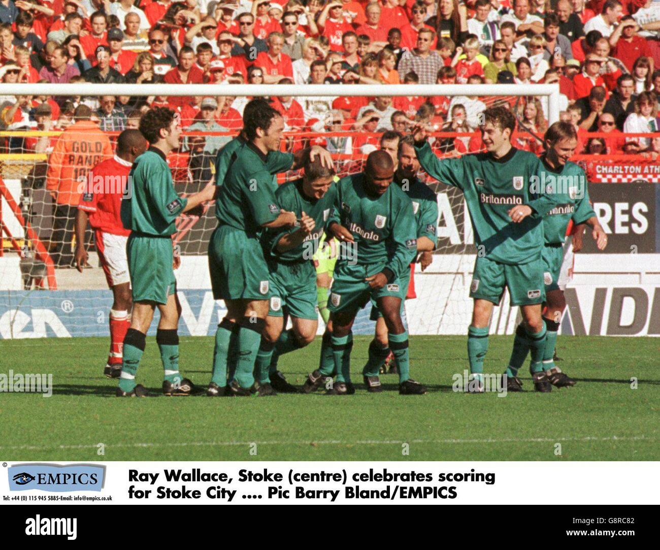 Ray Wallace of Stoke City (third right) is congratulated by his ...