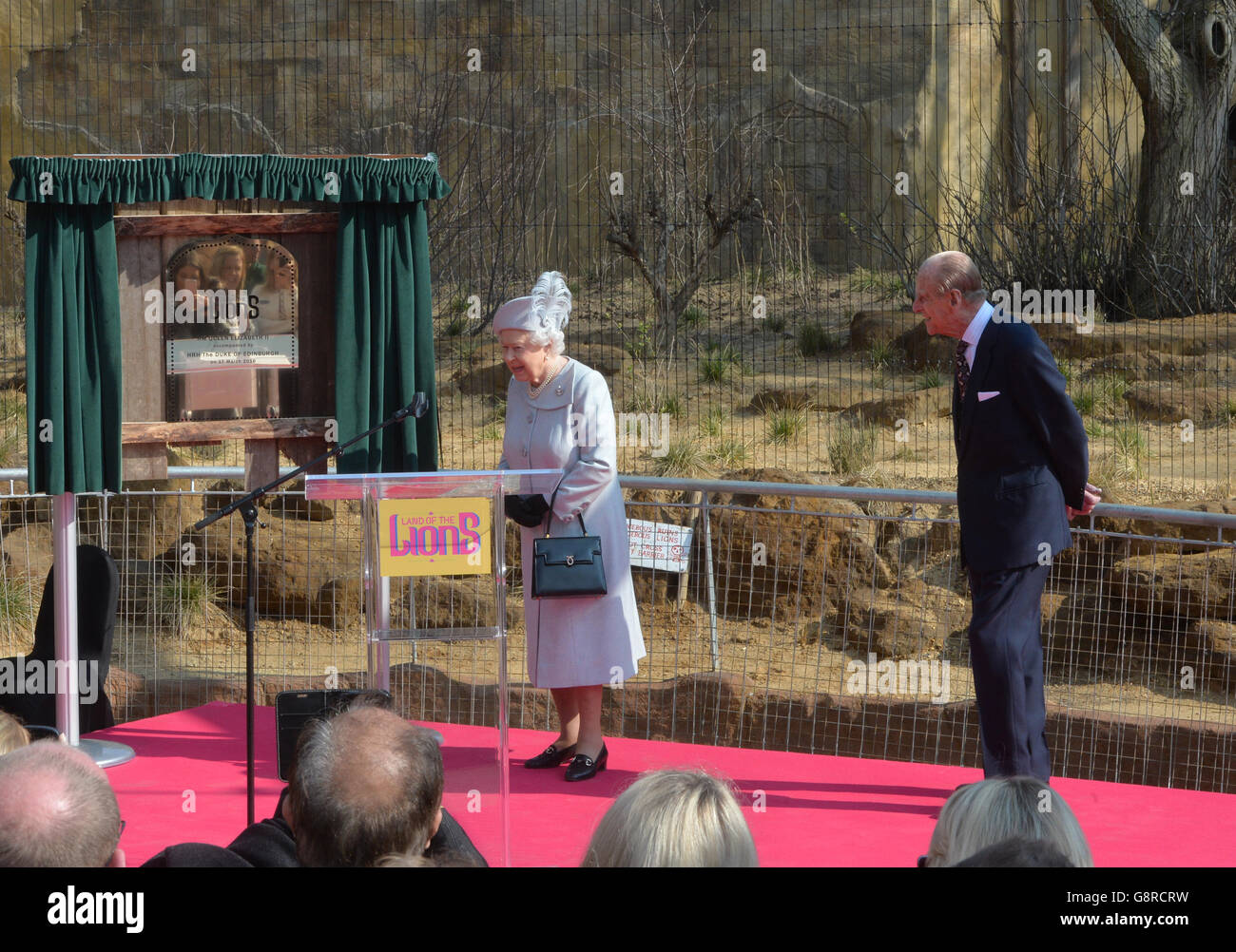 Queen Elizabeth II unveils a plaque as she officially opens the new ...
