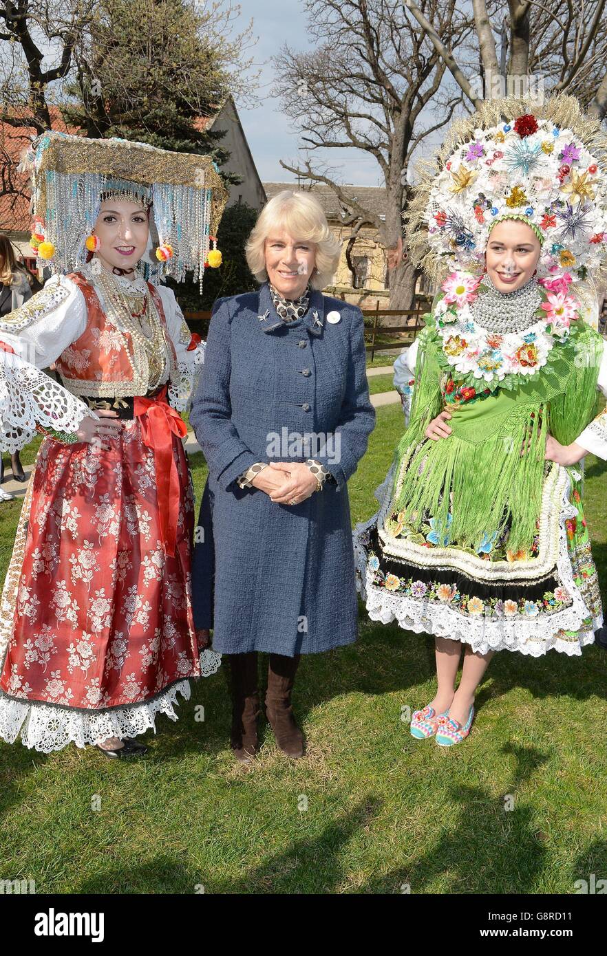The Duchess of Cornwall with girls in local traditional costumes, at ...