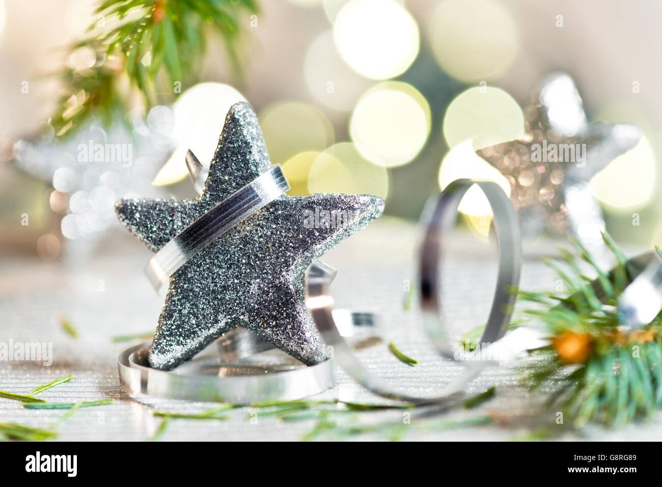 Christmas star and glitter on unfocused background Stock Photo - Alamy