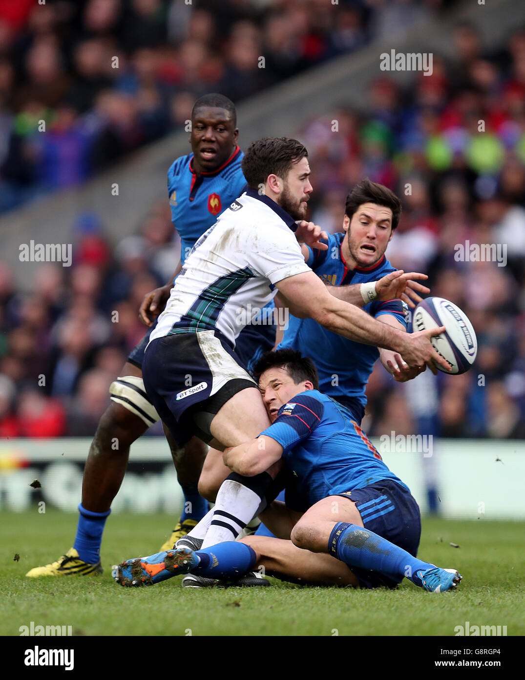 Scotland's Alex Dunbar is tackled by France's Francois Trinh-Duc ...