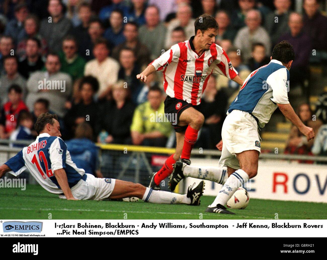 Andy Williams of Southampton (centre) skips around the tackle of ...