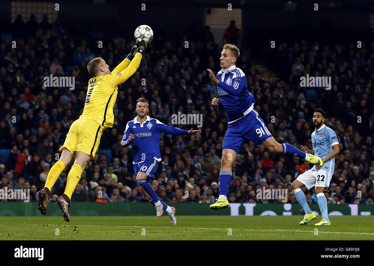 Manchester City goalkeeper Joe Hart punches clear under pressure from ...