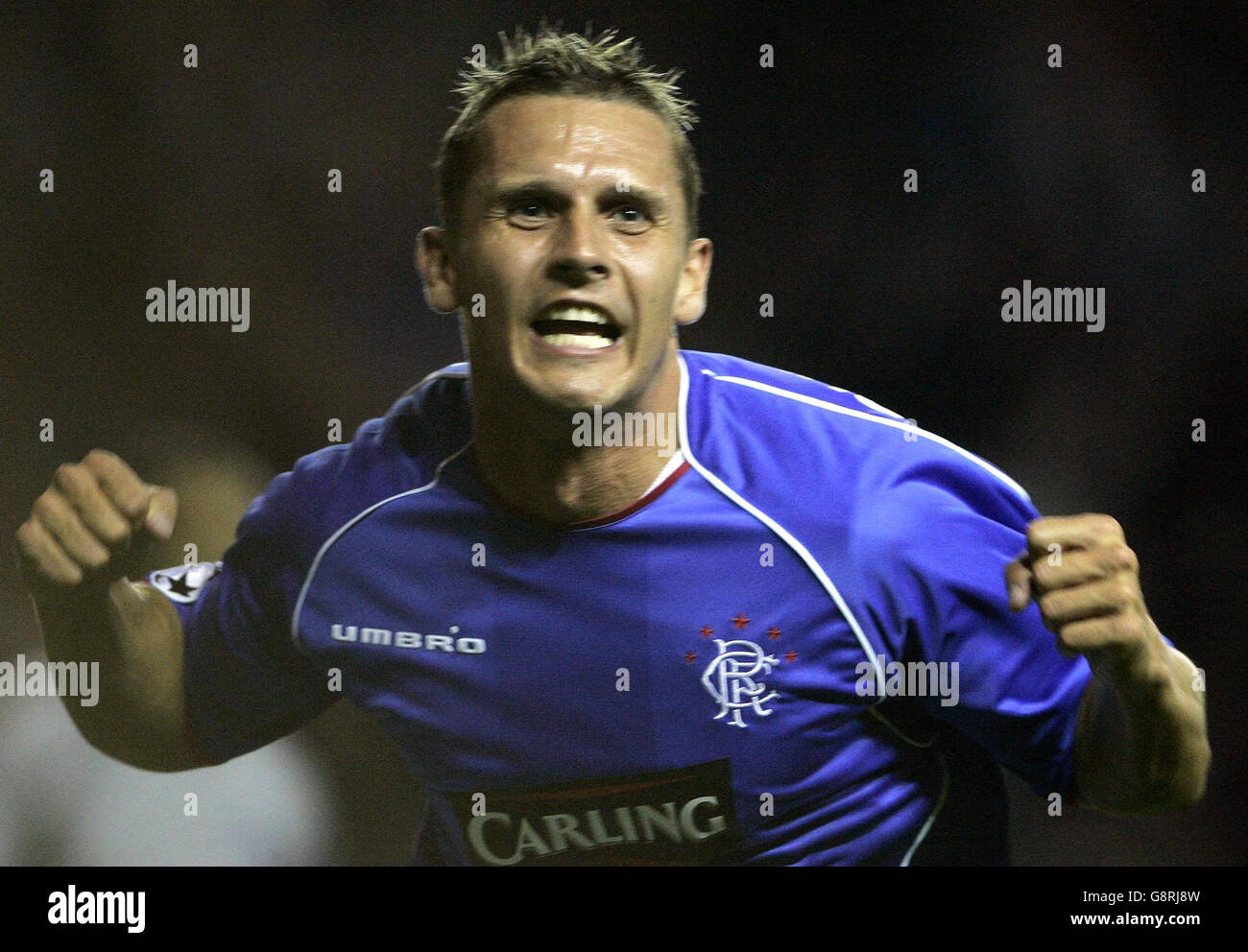 Rangers' Peter Lovenkrands celebrates scoring against FC Porto during ...