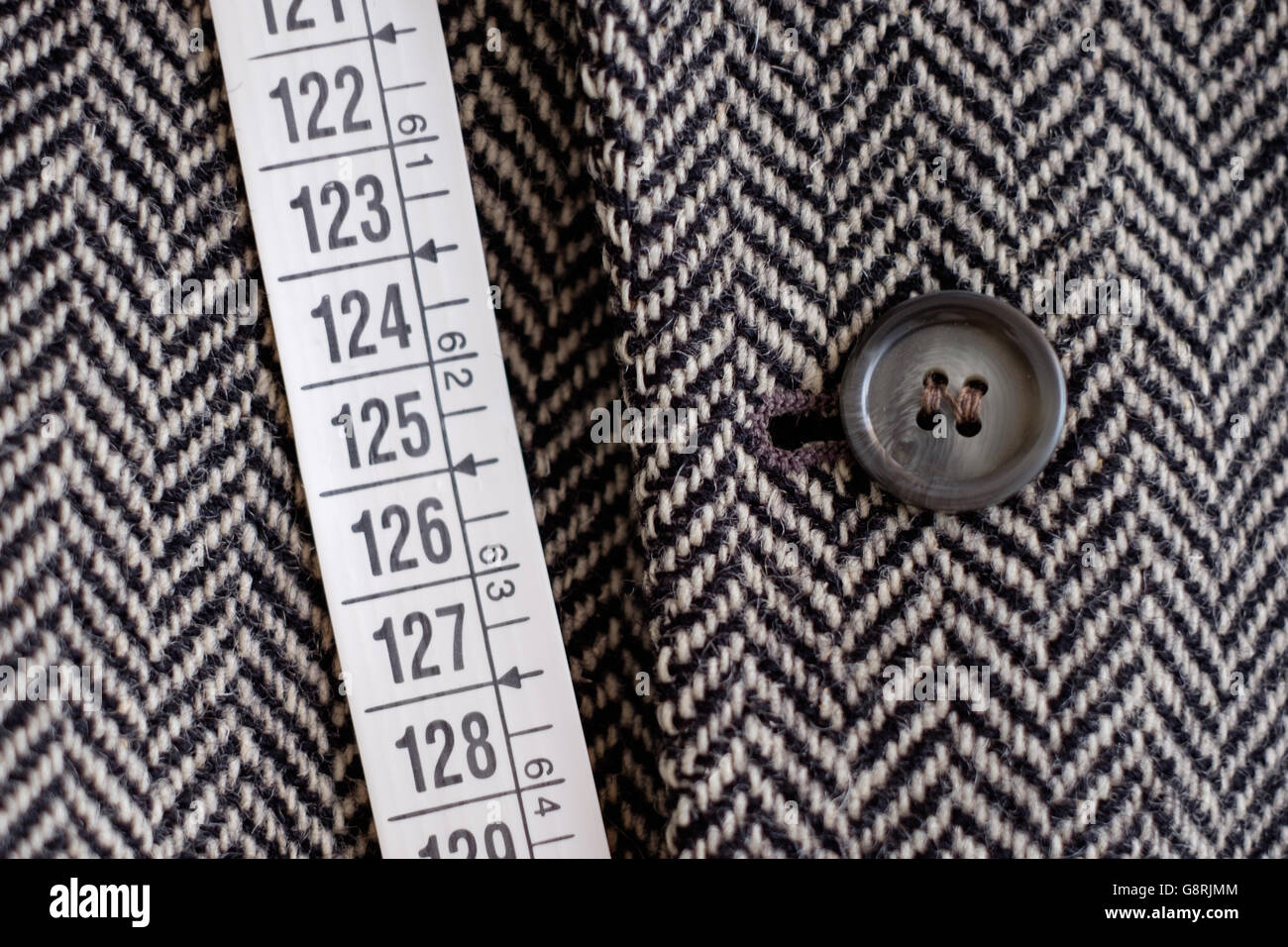 Tailor tape measure and fabric close-up detail Stock Photo - Alamy