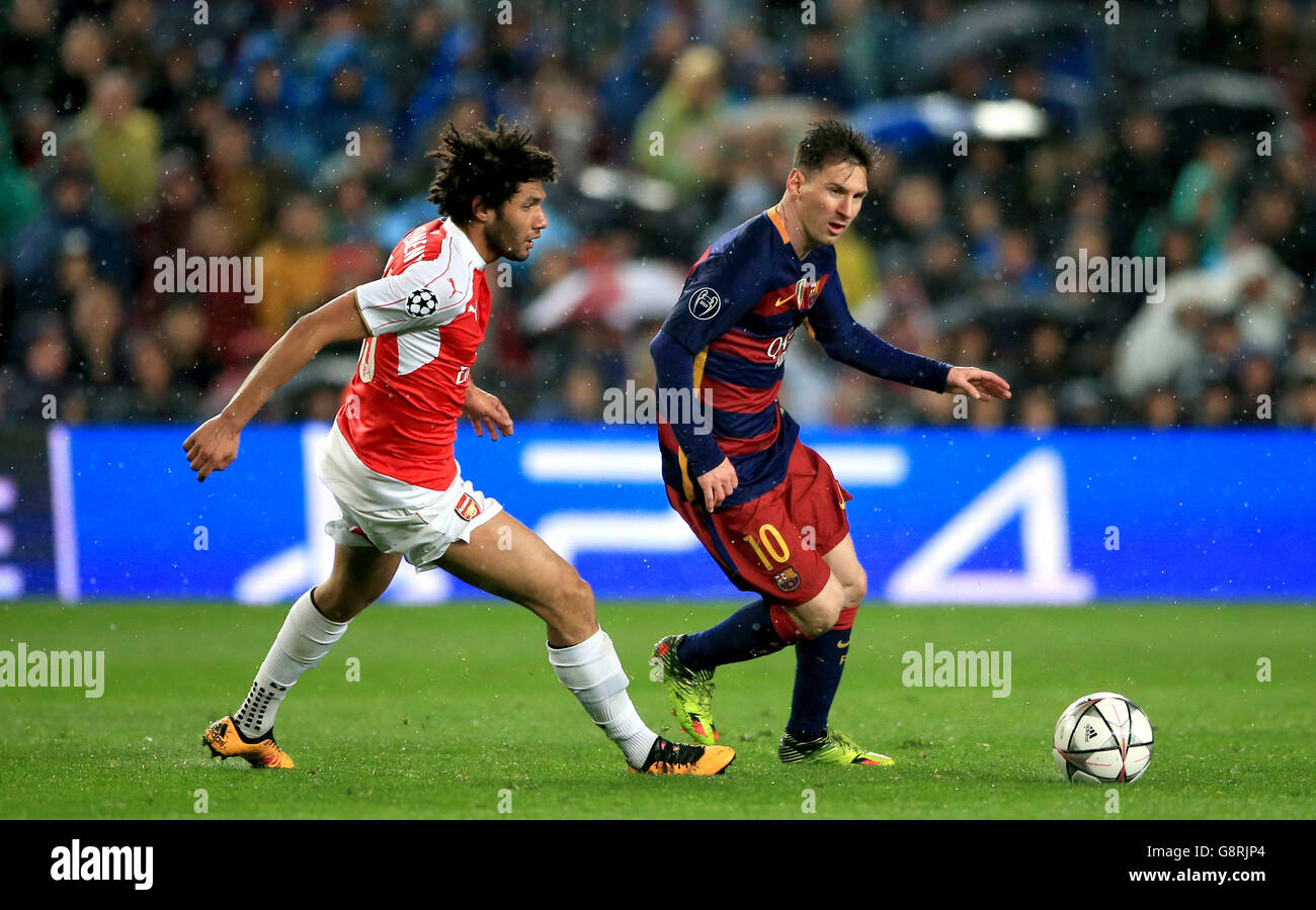 Barcelona's Lionel Messi gets away from Arsenal's Mohamed Elneny (left ...