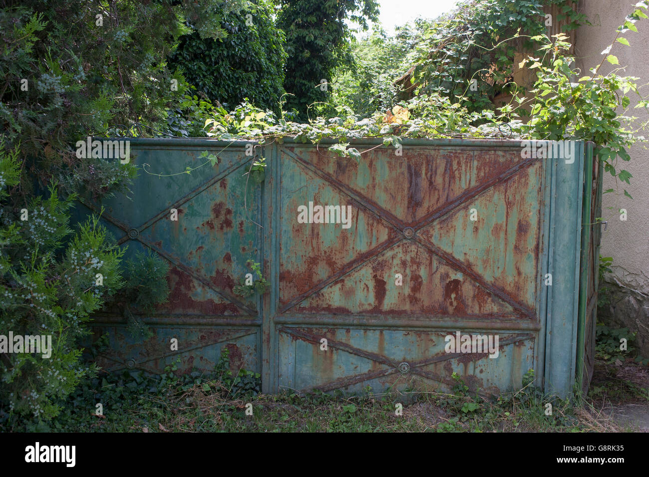Rusting front gates of abandoned home and land in the village of ...