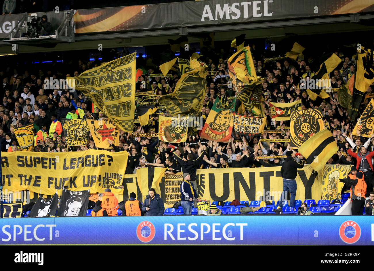 Borussia dortmund fans cheer on their side in the stands hi-res stock ...