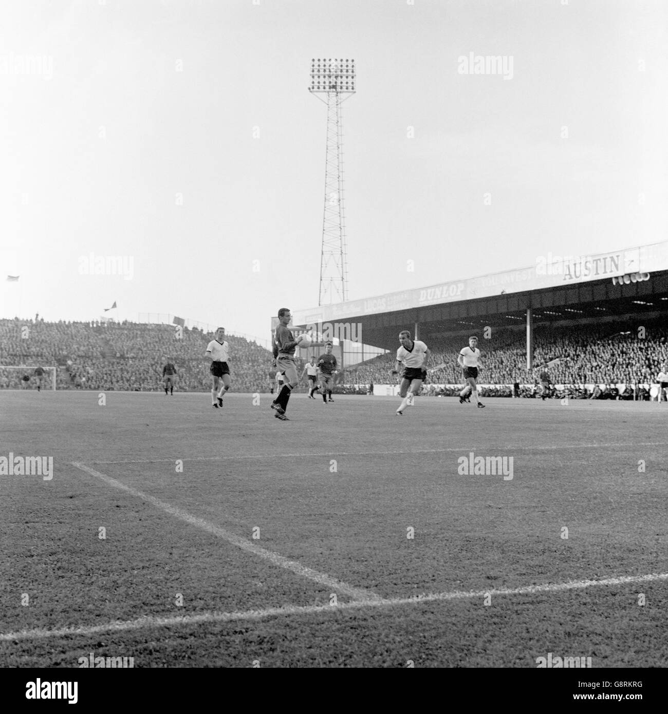 Spain's Jose Maria Fuste (second l) brings the ball down on his chest ...