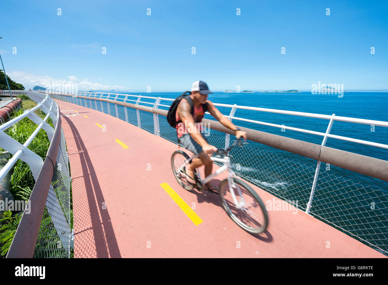 RIO DE JANEIRO - MARCH 19, 2016: Brazilian rides a bicycle along the Ciclovia Tim Maia bike path ...