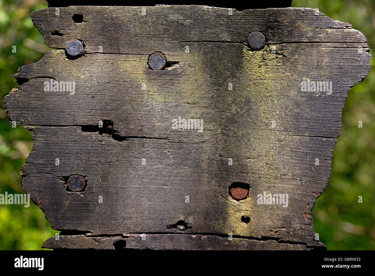 Old split wooden noticeboard and rusty nail background Stock Photo - Alamy
