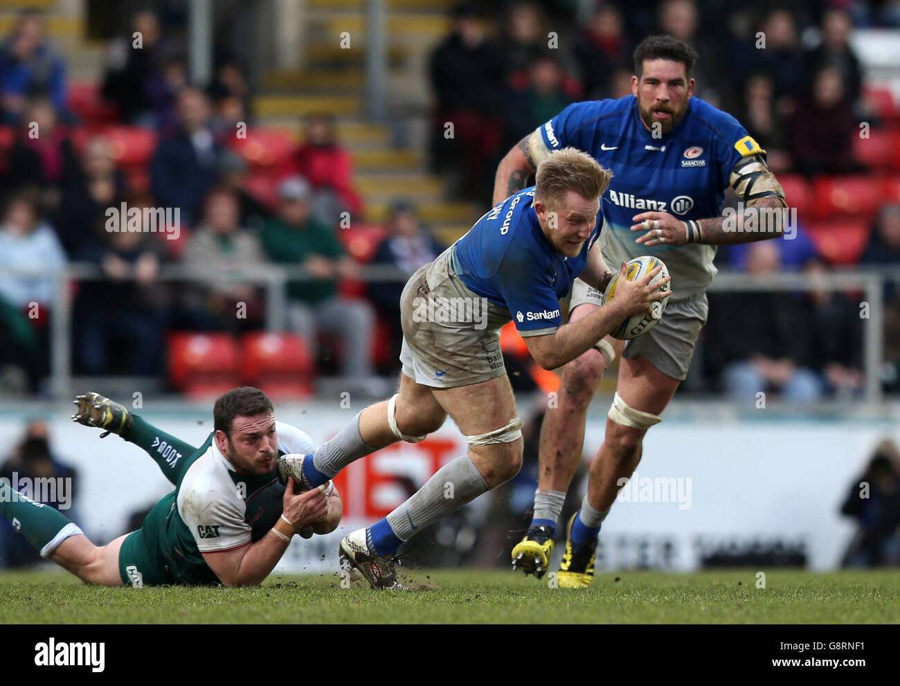 Saracens' Jackson Wray (front) is held back during the Aviva ...