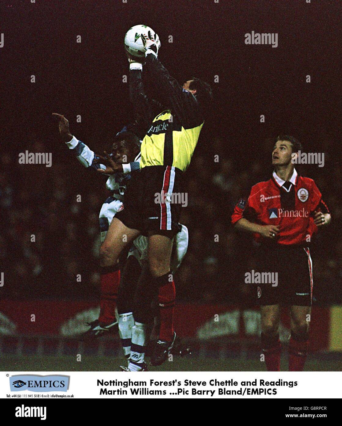Nottingham Forest's stand-in goalkeeper Steve Chettle (centre) leaps ...