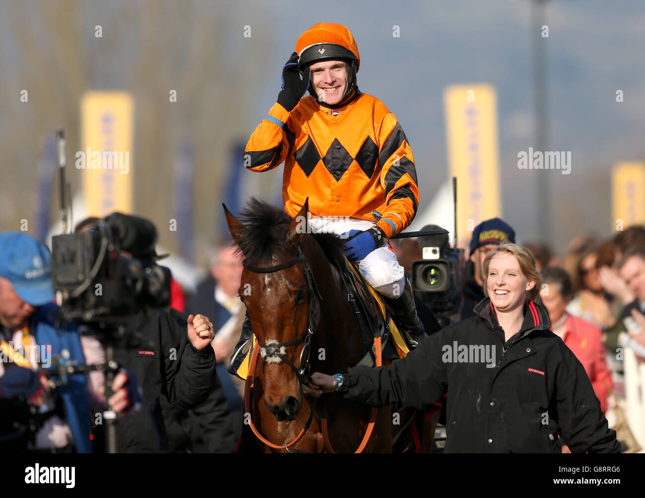 Jockey Tom Scudamore celebrates after winning the Ryanair World Hurdle ...