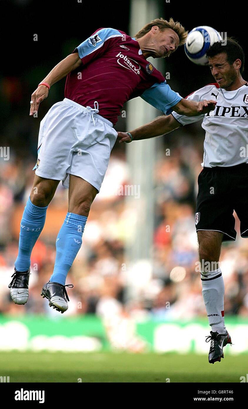 West Ham United's Teddy Sheringham and Fulham's Niclas Jensen battle ...