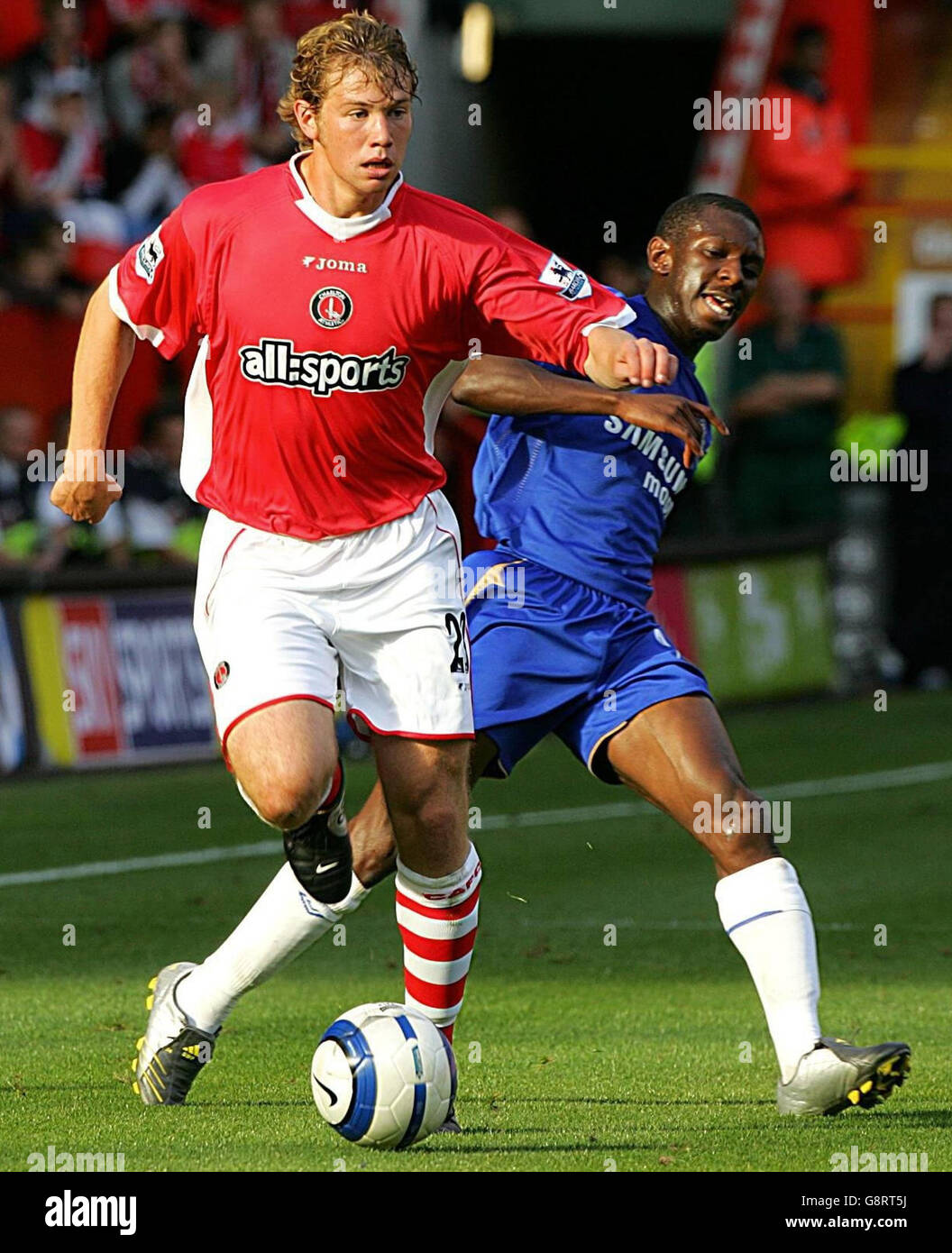 Charlton Athletic's Jonathan Spector (L) tussles with Chelsea's Shaun ...